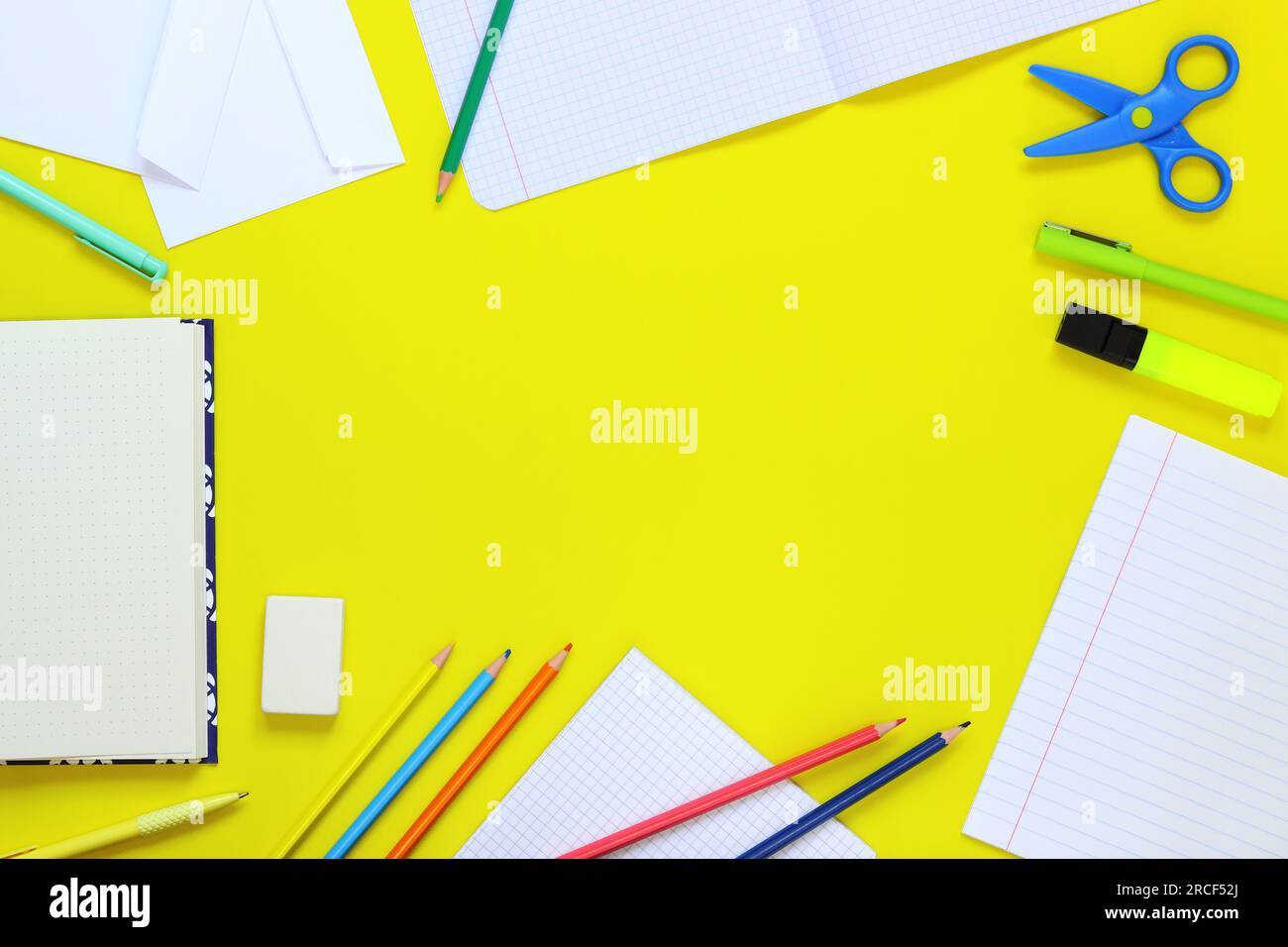 Back to school. Workspace, top view, flat lay. Open notebooks, pencils ...