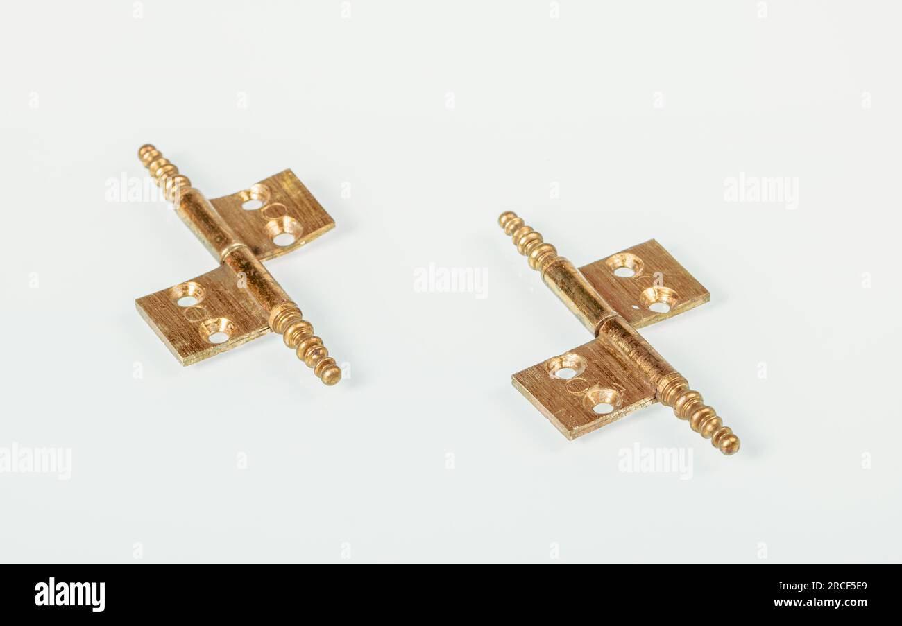 Furniture fittings. Two brass retro hinges with traces of patina from ...