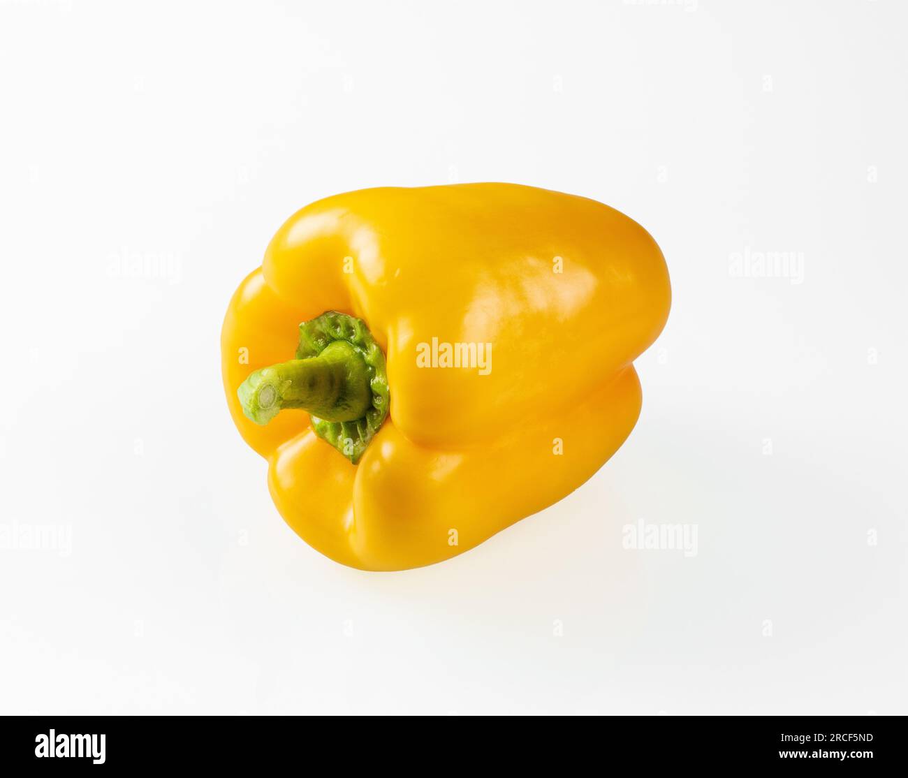 One large yellow paprika close-up on a white background Stock Photo - Alamy