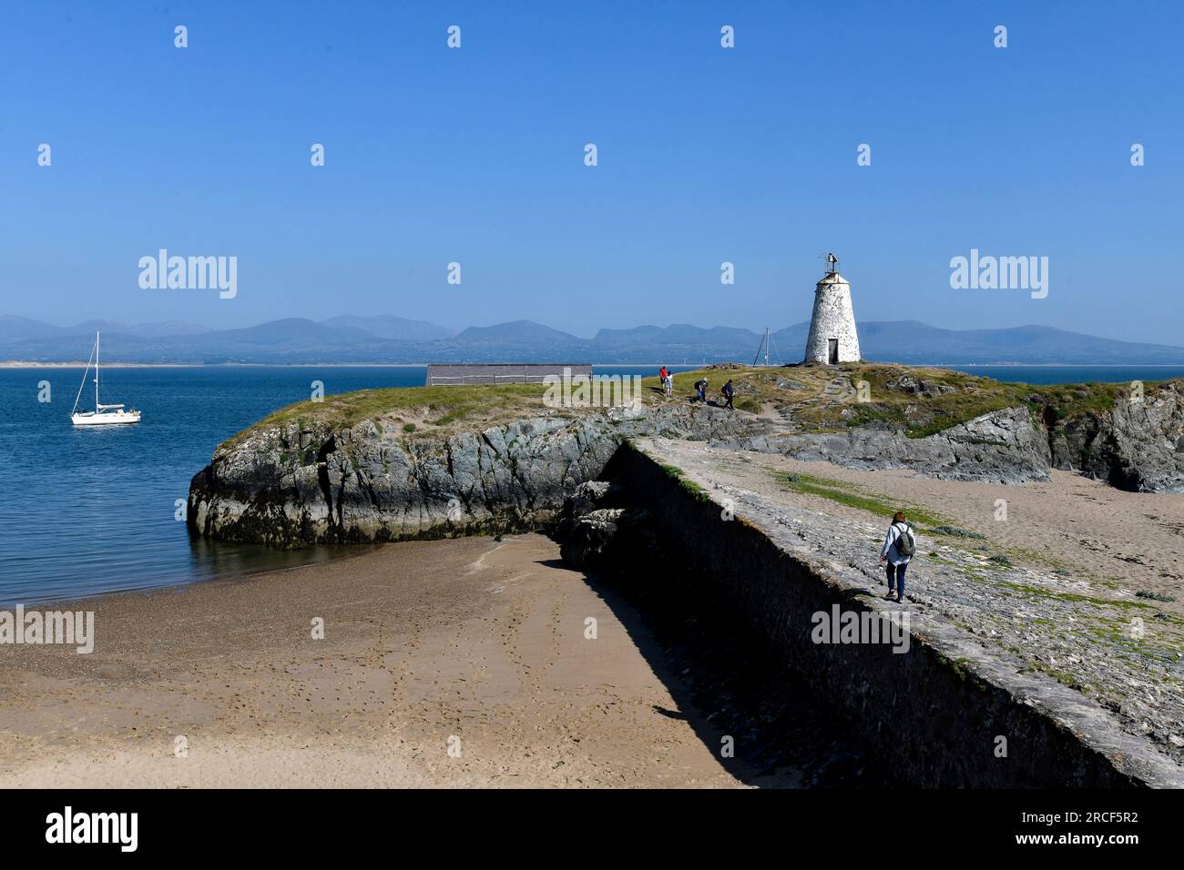 Twr Mawr the old lighthouse on the tidal island of Ynys Llanddwyn ...