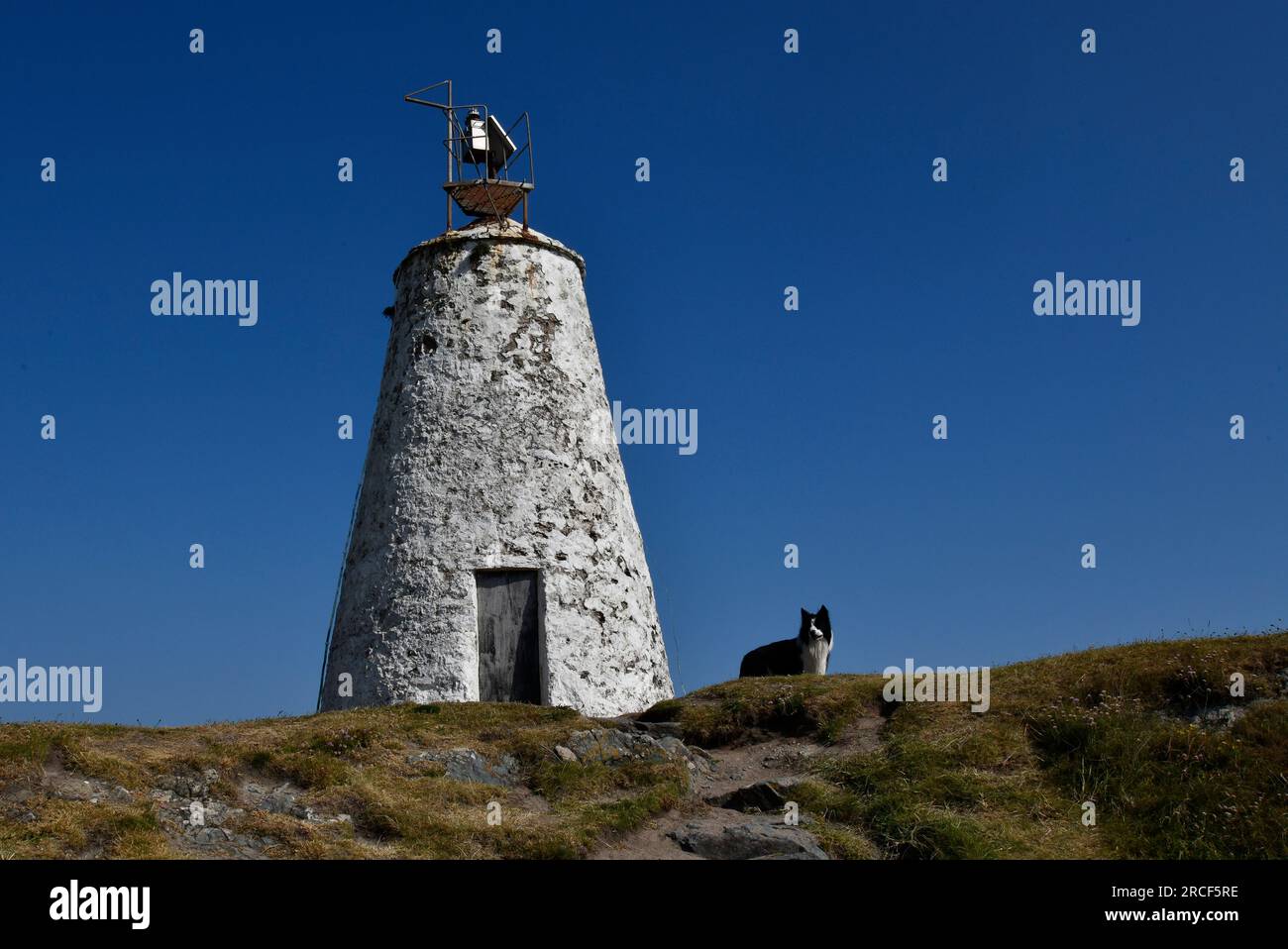 Twr Mawr the old lighthouse on the tidal island of Ynys Llanddwyn ...