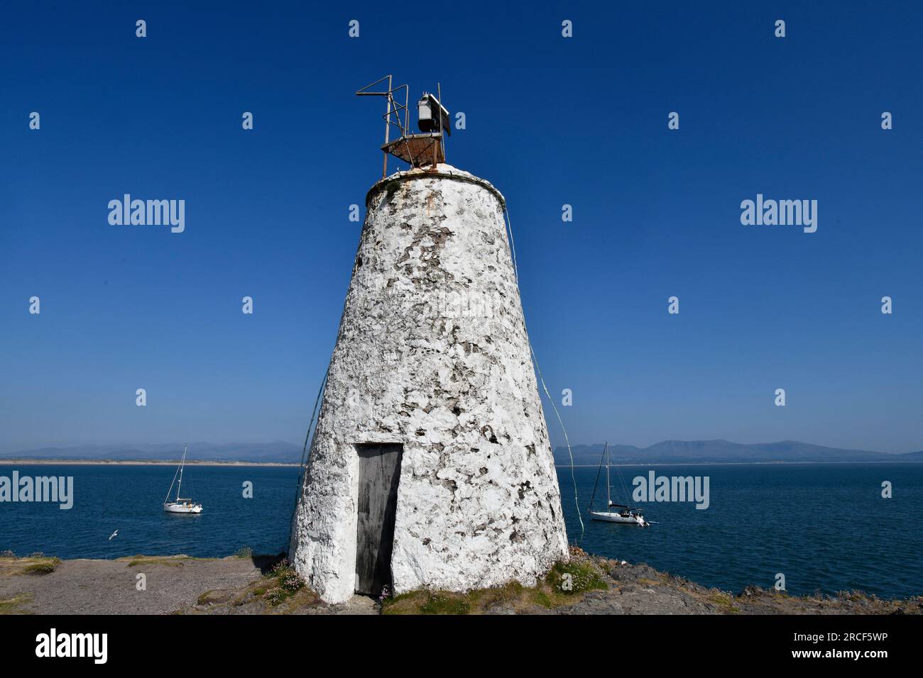 Twr Mawr the old lighthouse on the tidal island of Ynys Llanddwyn ...