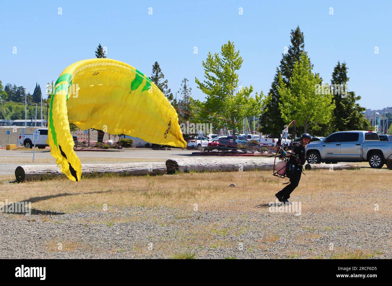 Series of images of a Powered paraglider launching from near the ...