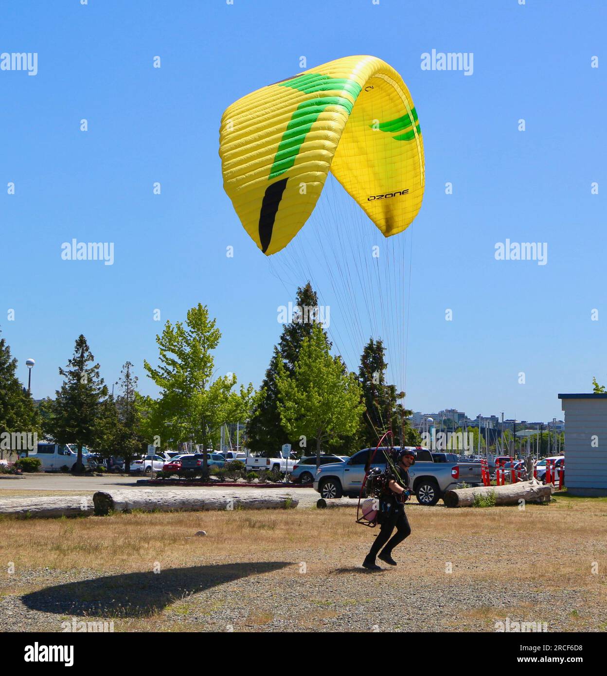 Series of images of a Powered paraglider launching from near the ...