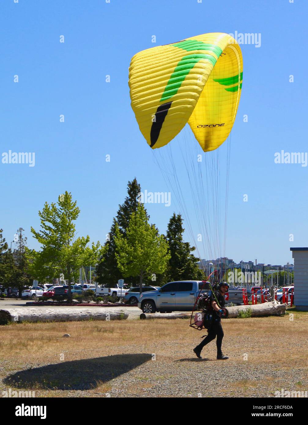 Series of images of a Powered paraglider launching from near the ...