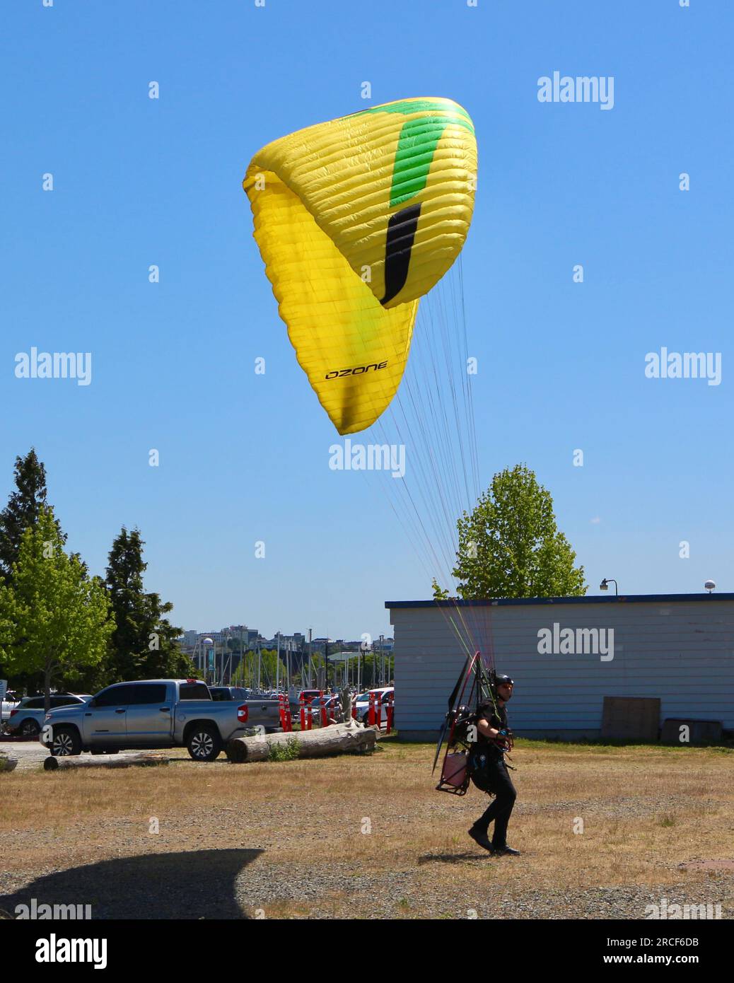 Series of images of a Powered paraglider launching from near the ...