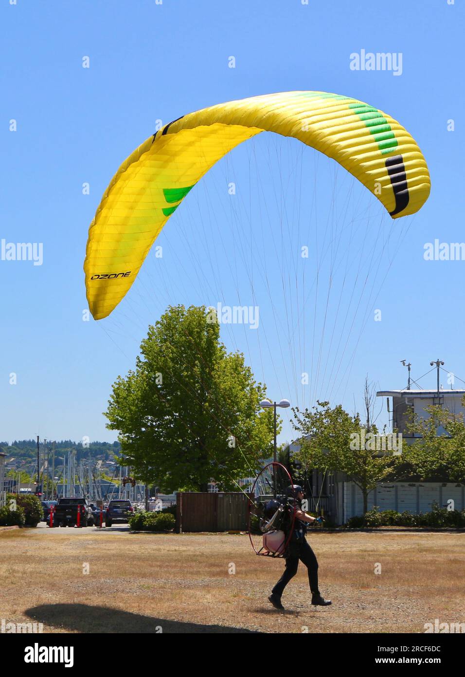 Series of images of a Powered paraglider launching from near the ...