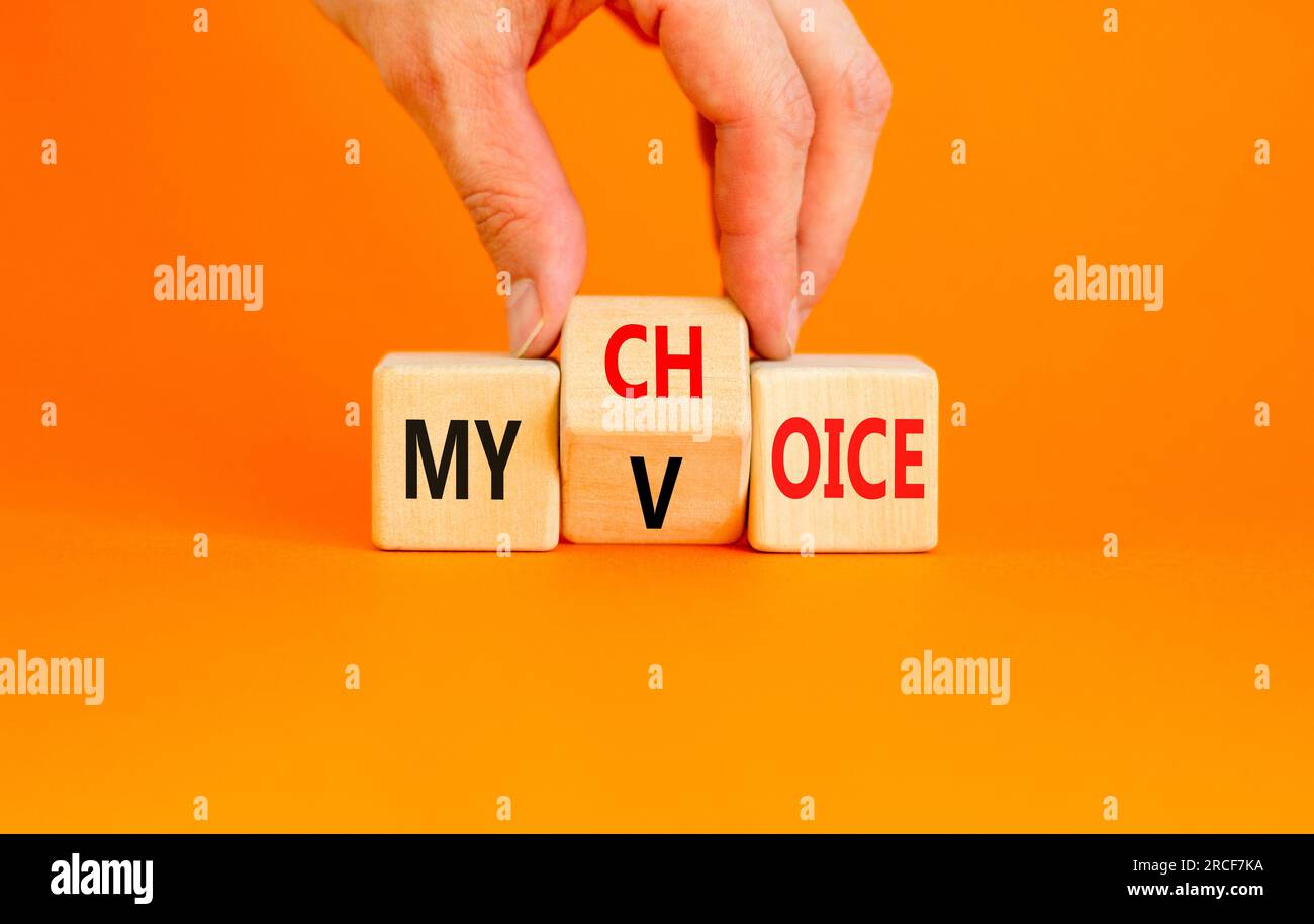 My voice and choice symbol. Businessman turns wooden cubes and changes ...
