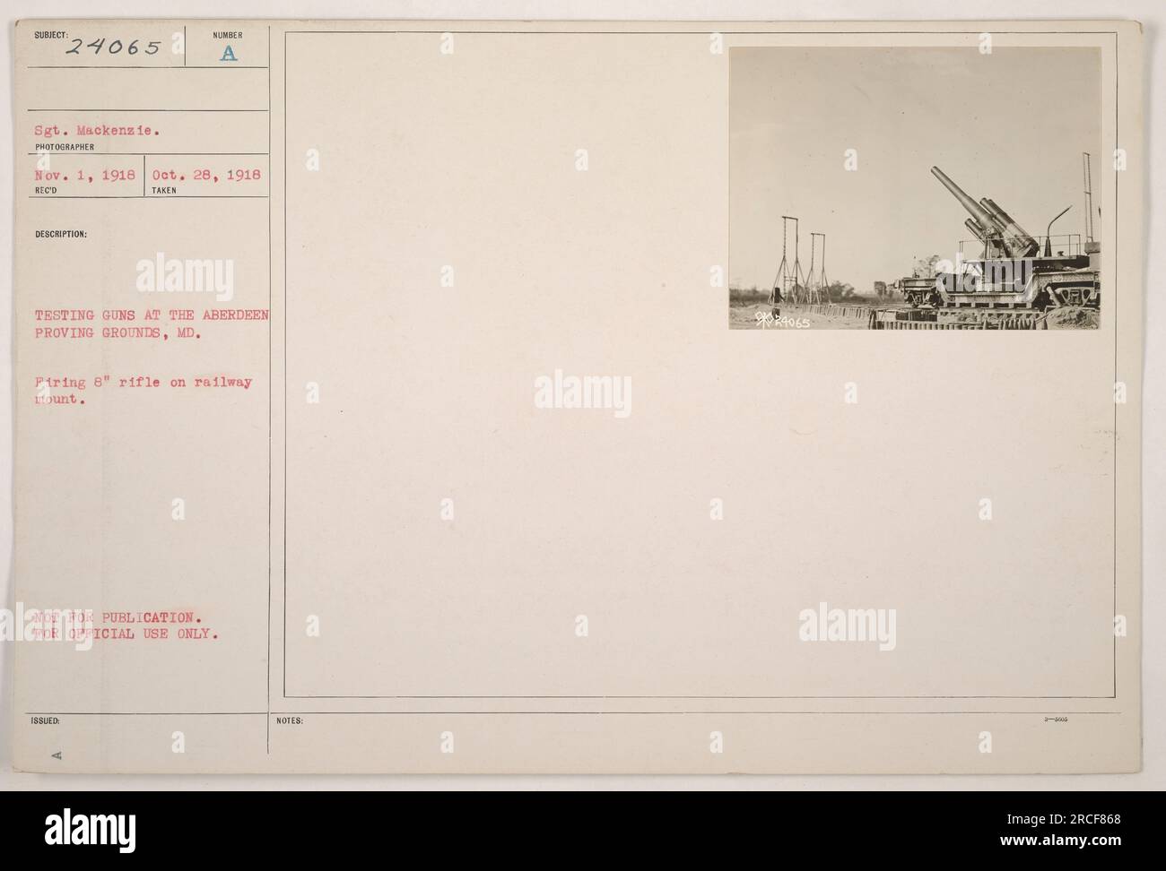 Sgt. Mackenzie, pictured here on October 28, 1918, is seen testing guns ...