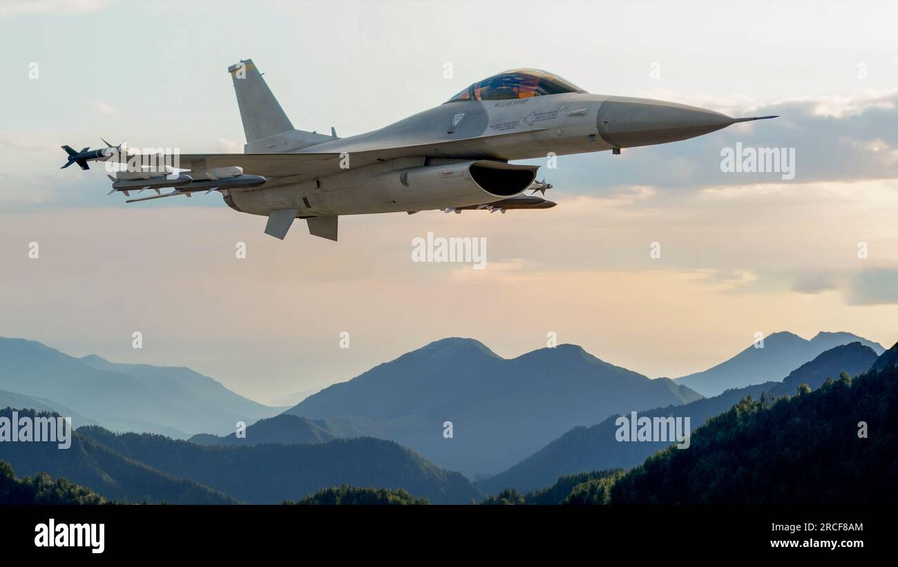 Military aircraft in flight equipped with missiles, combat set-up. F-16 ...