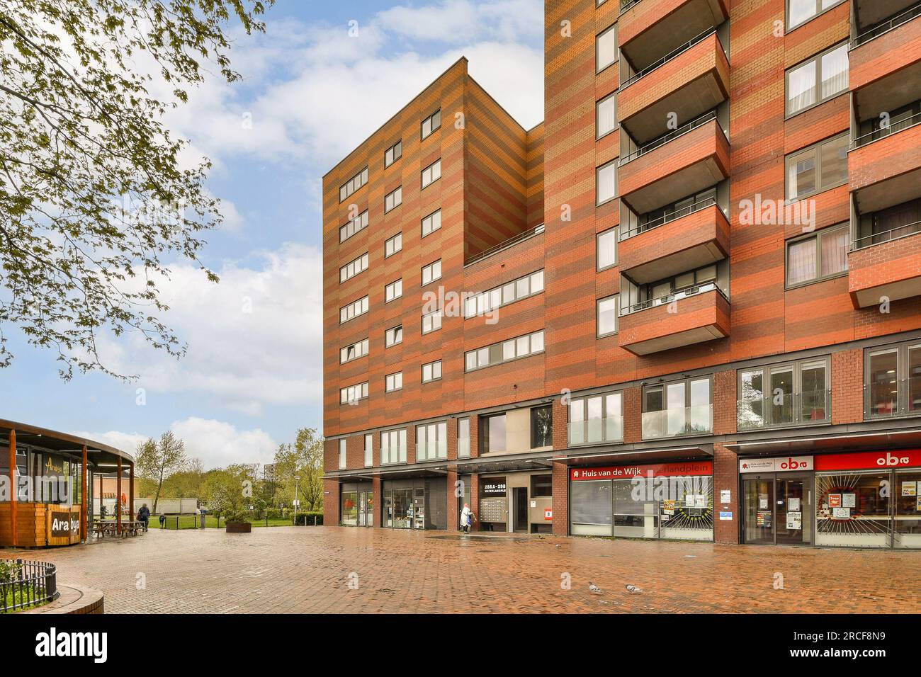 a bricked building in the middle of an urban area with buildings on ...