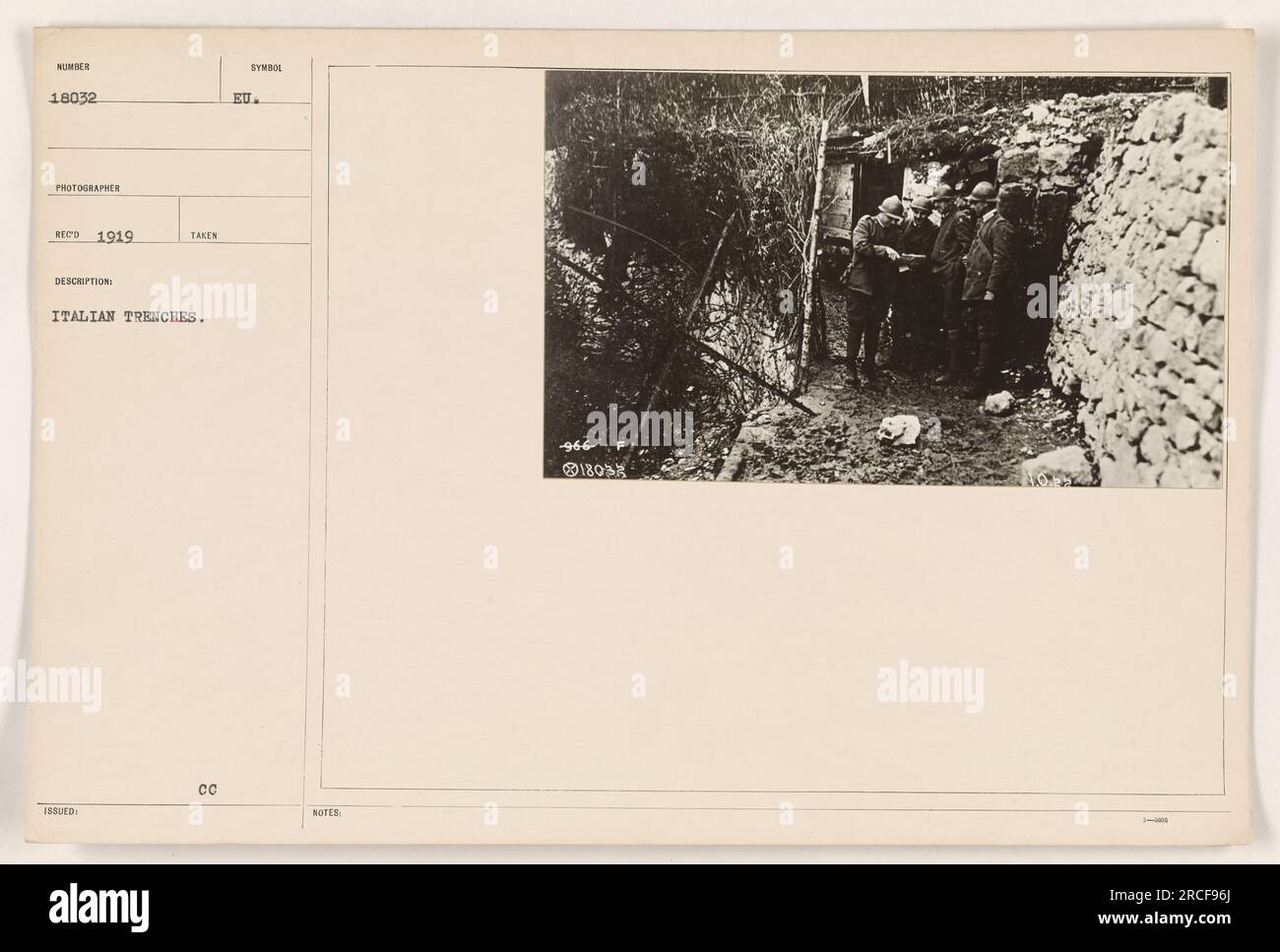 Fifty American soldiers stand in front of Italian trenches during World ...