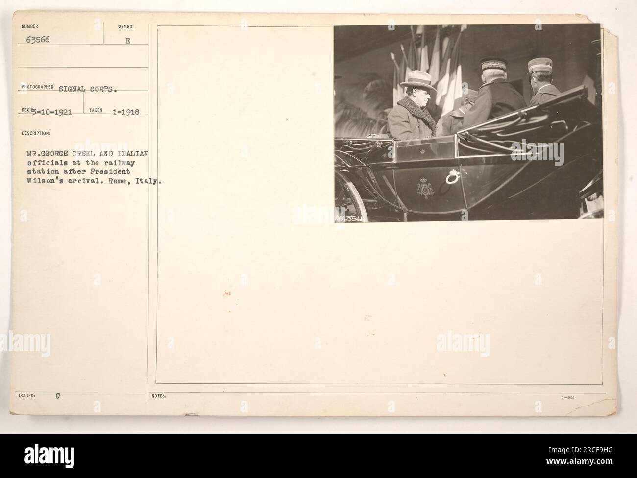 Mr. George Creel and Italian officials are seen at the railway station ...