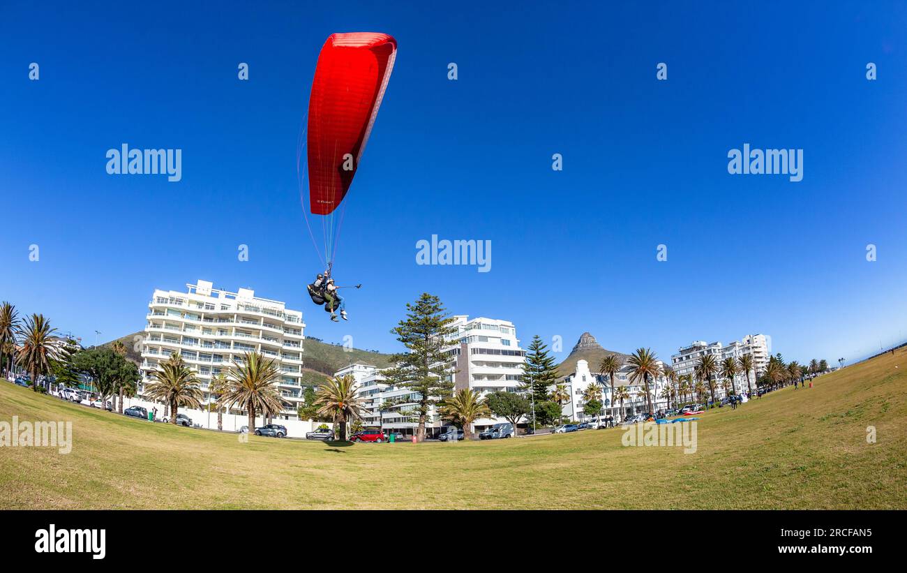 Paraglider tandem red parachute closeup flight landing front of ...
