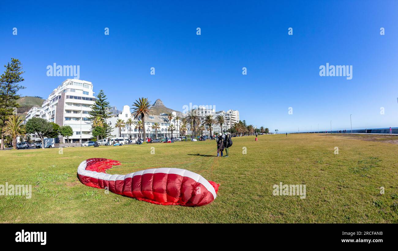 Paraglider tandem red parachute closeup flight landing front of ...