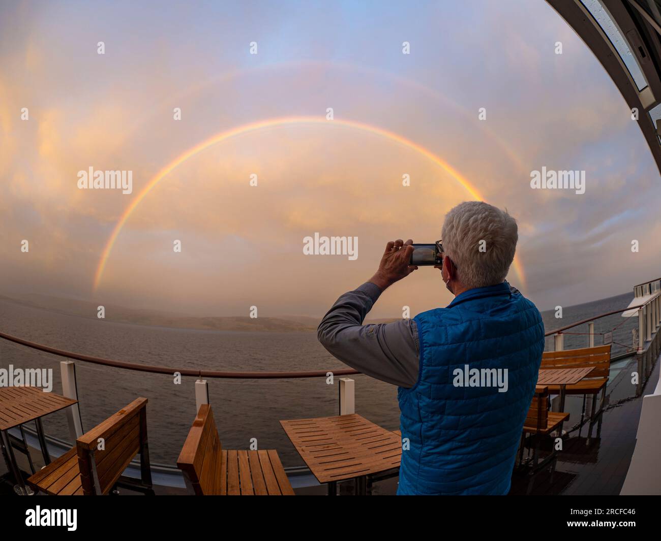 An photographer shooting a double rainbow from the National Geographic ...