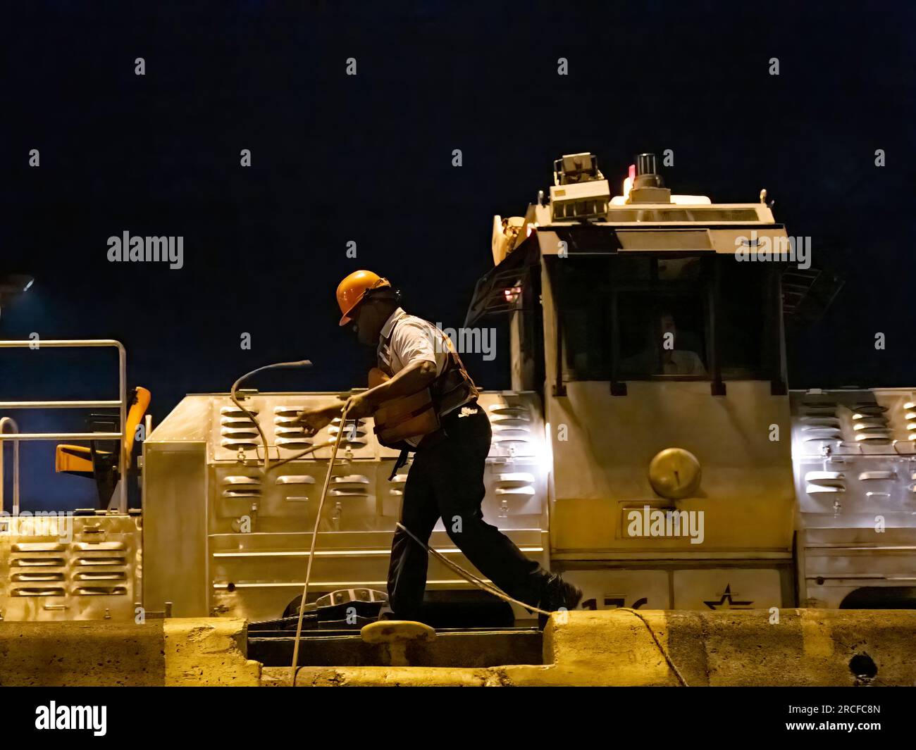 Workers for the Panama Canal handling lines at the Gatun Locks on the ...