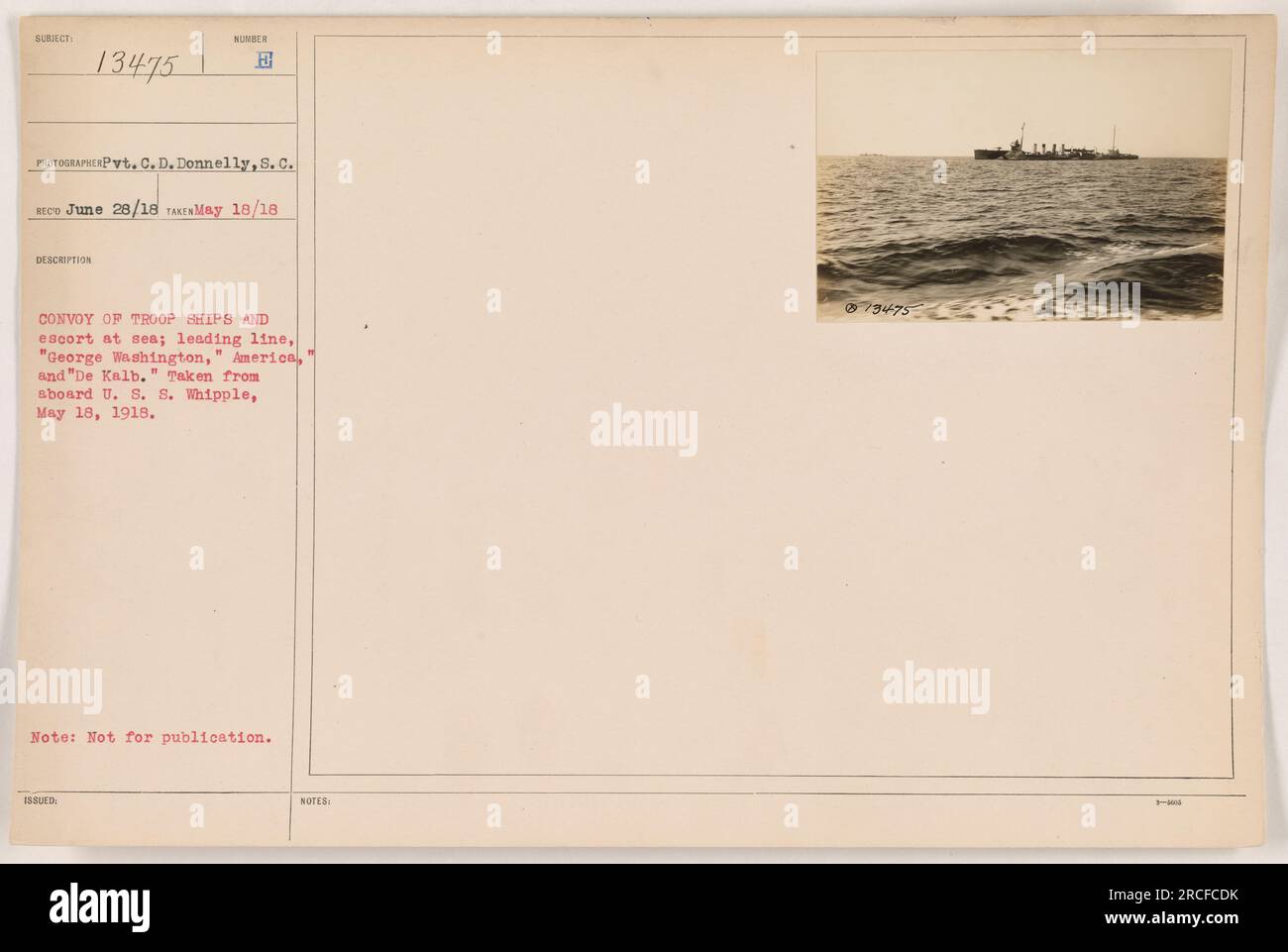 This photograph depicts a convoy of troop ships with an escort at sea ...