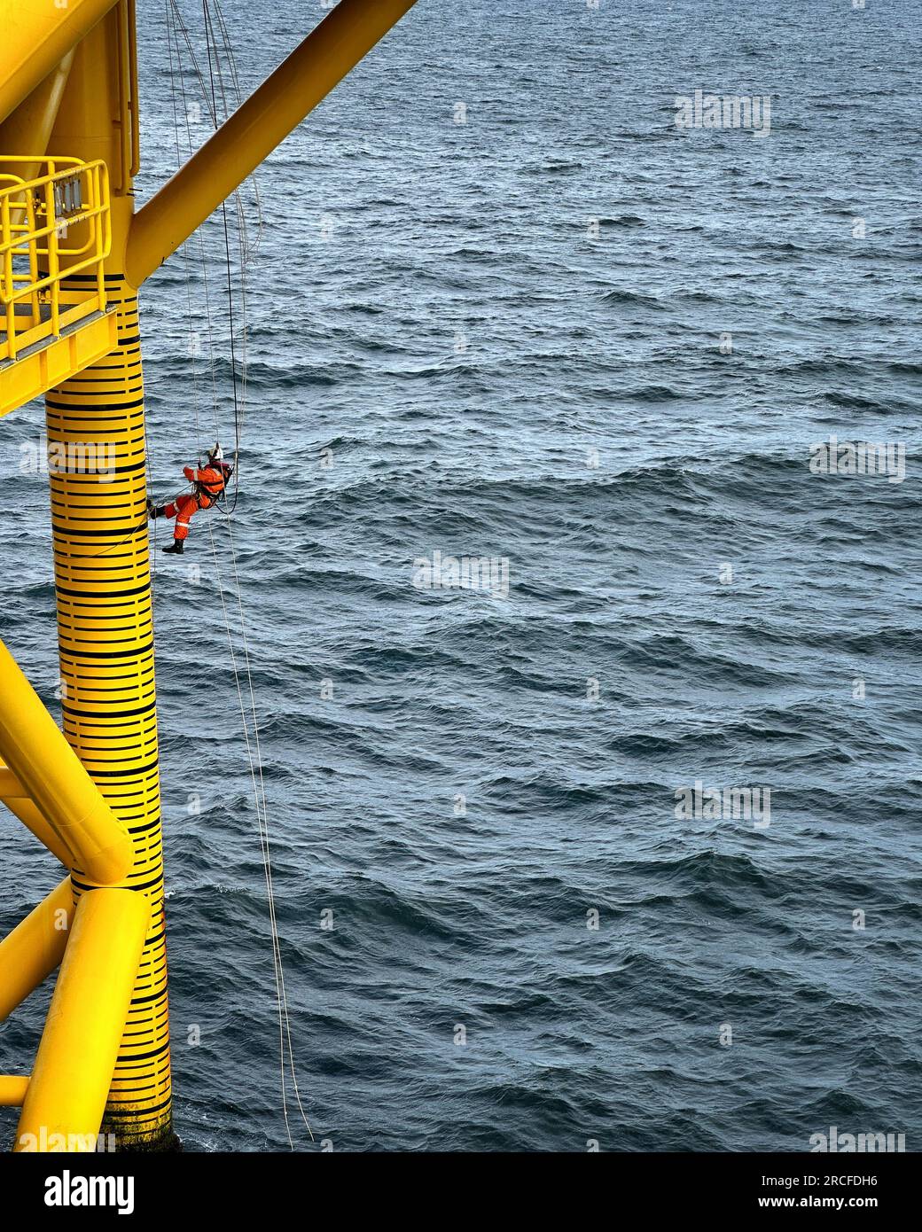 North sea worker, IRATA rope access, climbing. Oil rig. Wind farm sub ...