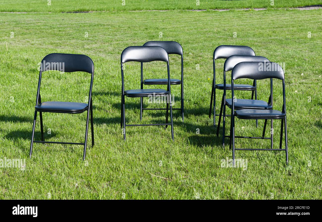 office chairs on the grass for conferences Stock Photo - Alamy