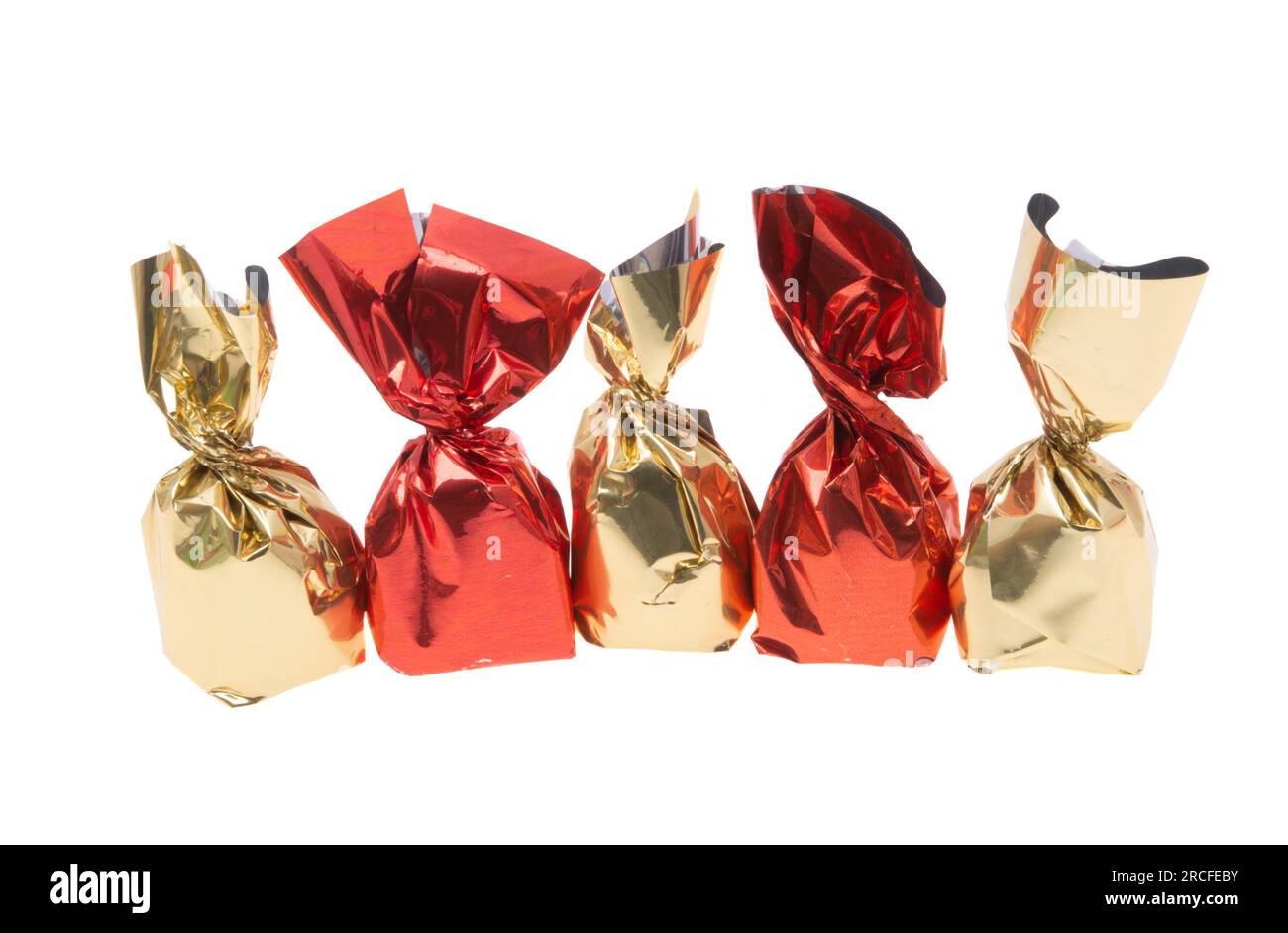 chocolate candies in wrapper isolated on white background Stock Photo ...