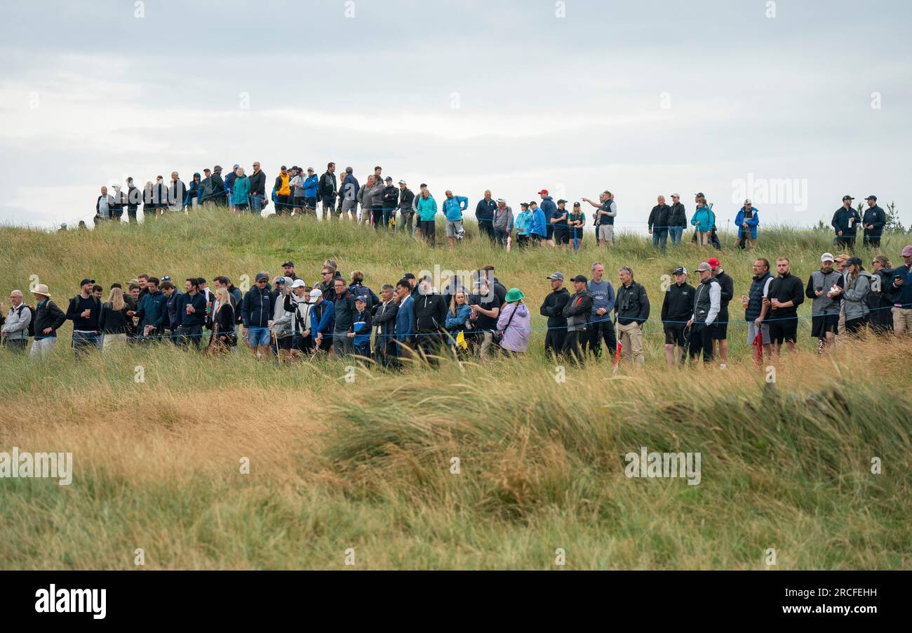 North Berwick, East Lothian, Scotland, UK. 14th July 2023. Spectators line the 13th fairway at ...