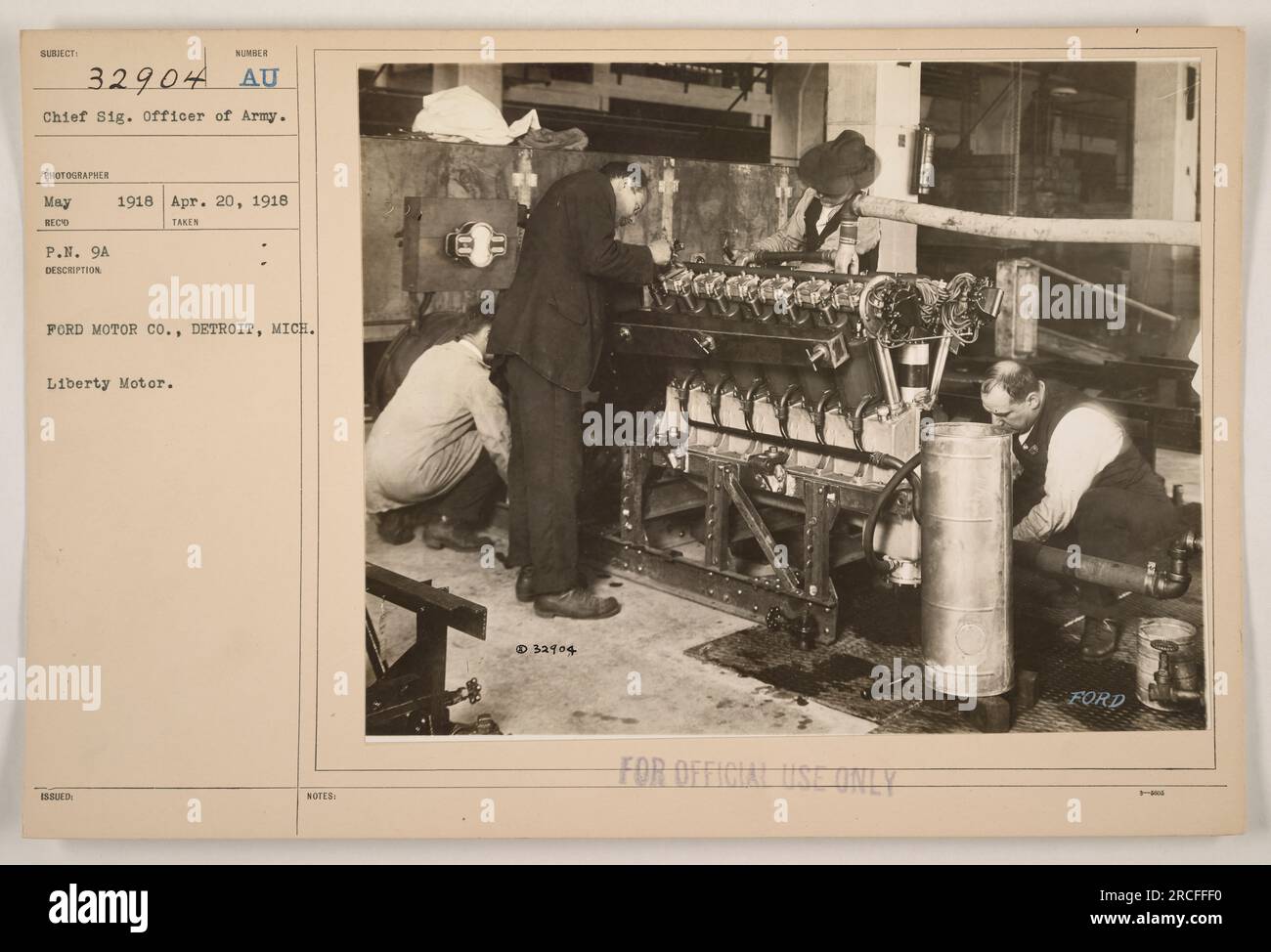 A senior army officer inspects a Liberty Motor at Ford Motor Co. in ...