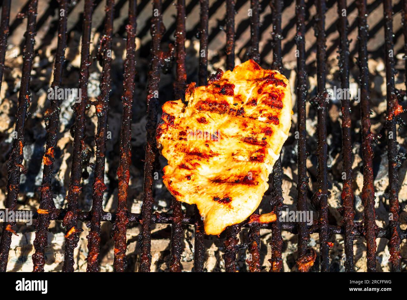 Steak grilled on a charcoal barbeque. Top view of camping tasty ...