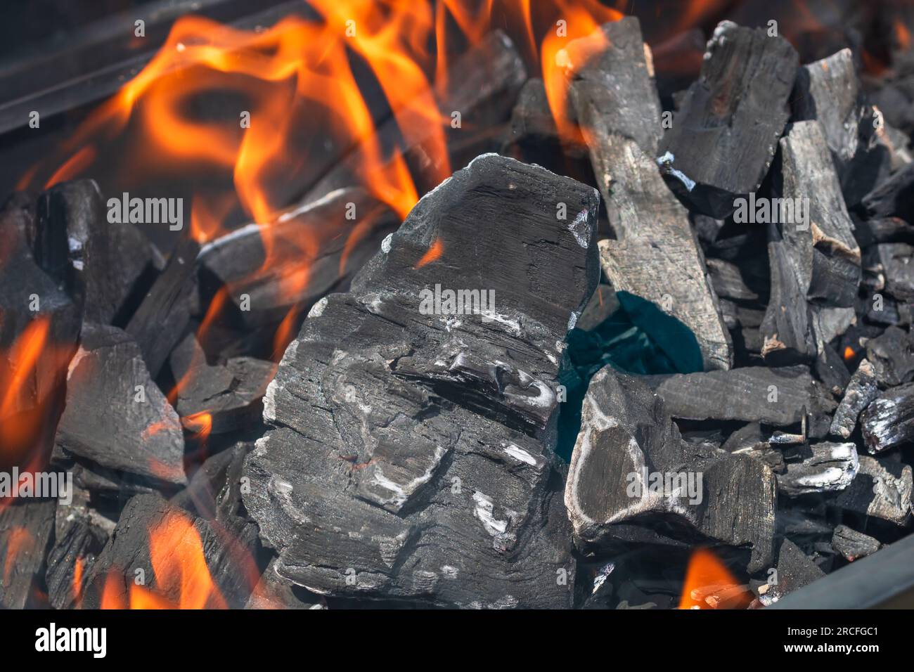 Barbecue grill pit with glowing and flaming hot open fire with red ...