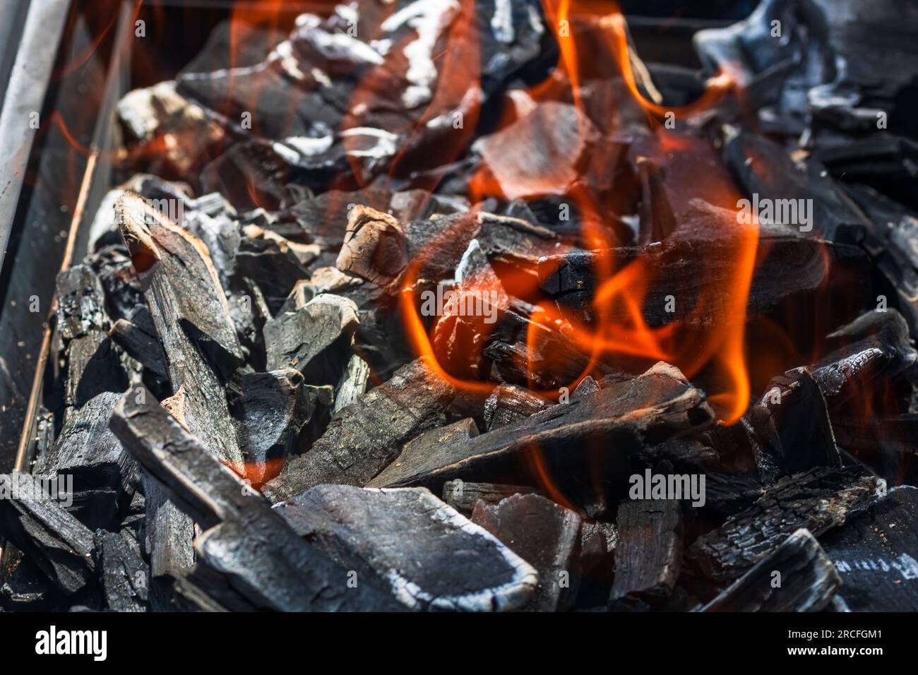 Barbecue grill pit with glowing and flaming hot open fire with red ...