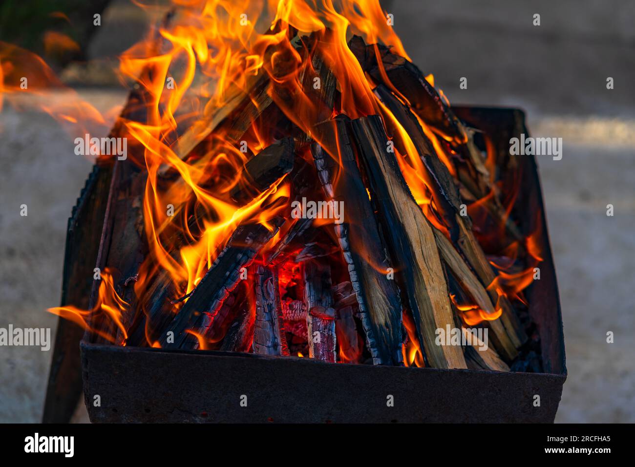 Burning wood chips to form coal. Barbecue preparation, fire before ...