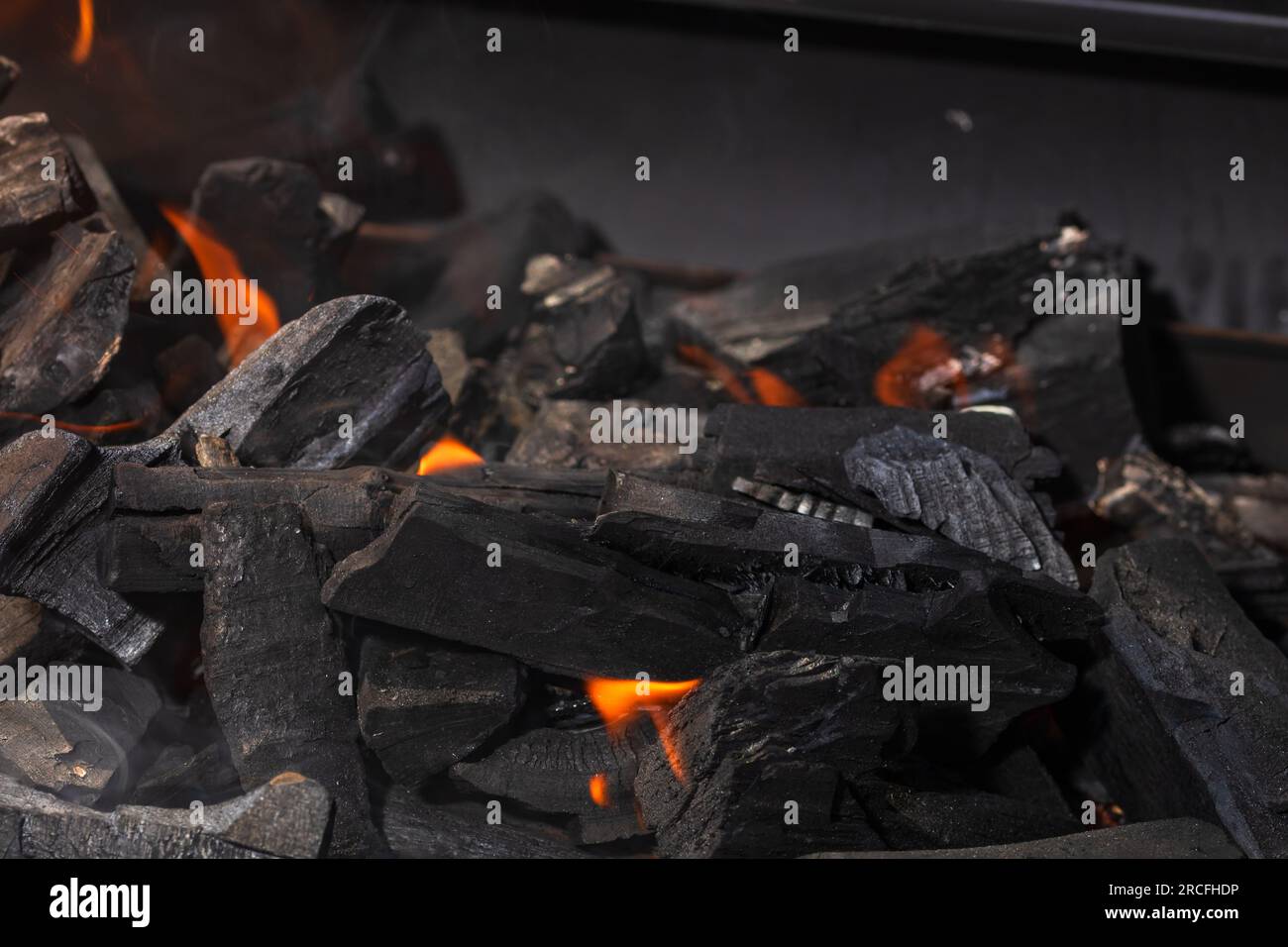 Barbecue grill pit with glowing and flaming hot open fire with red ...