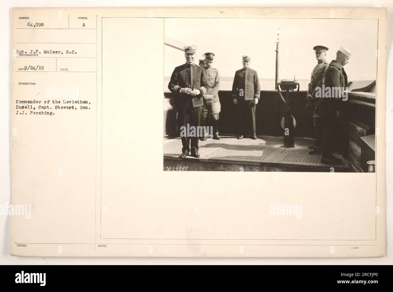 The photograph shows Commander Durell, Captain Stewart, and General J.J ...