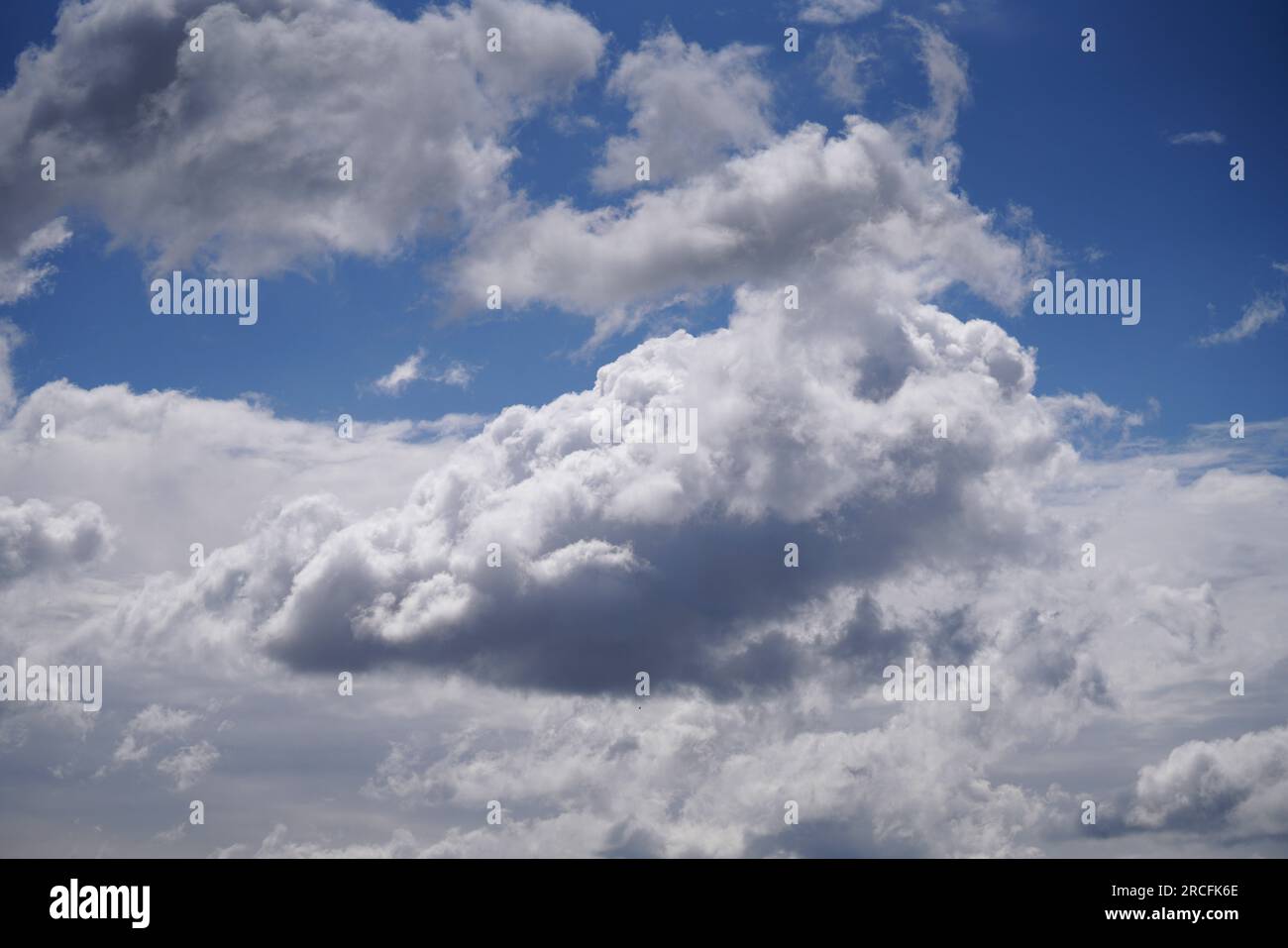 Stratus cumulus alto nimbo clouds in the blue sky are weather ...