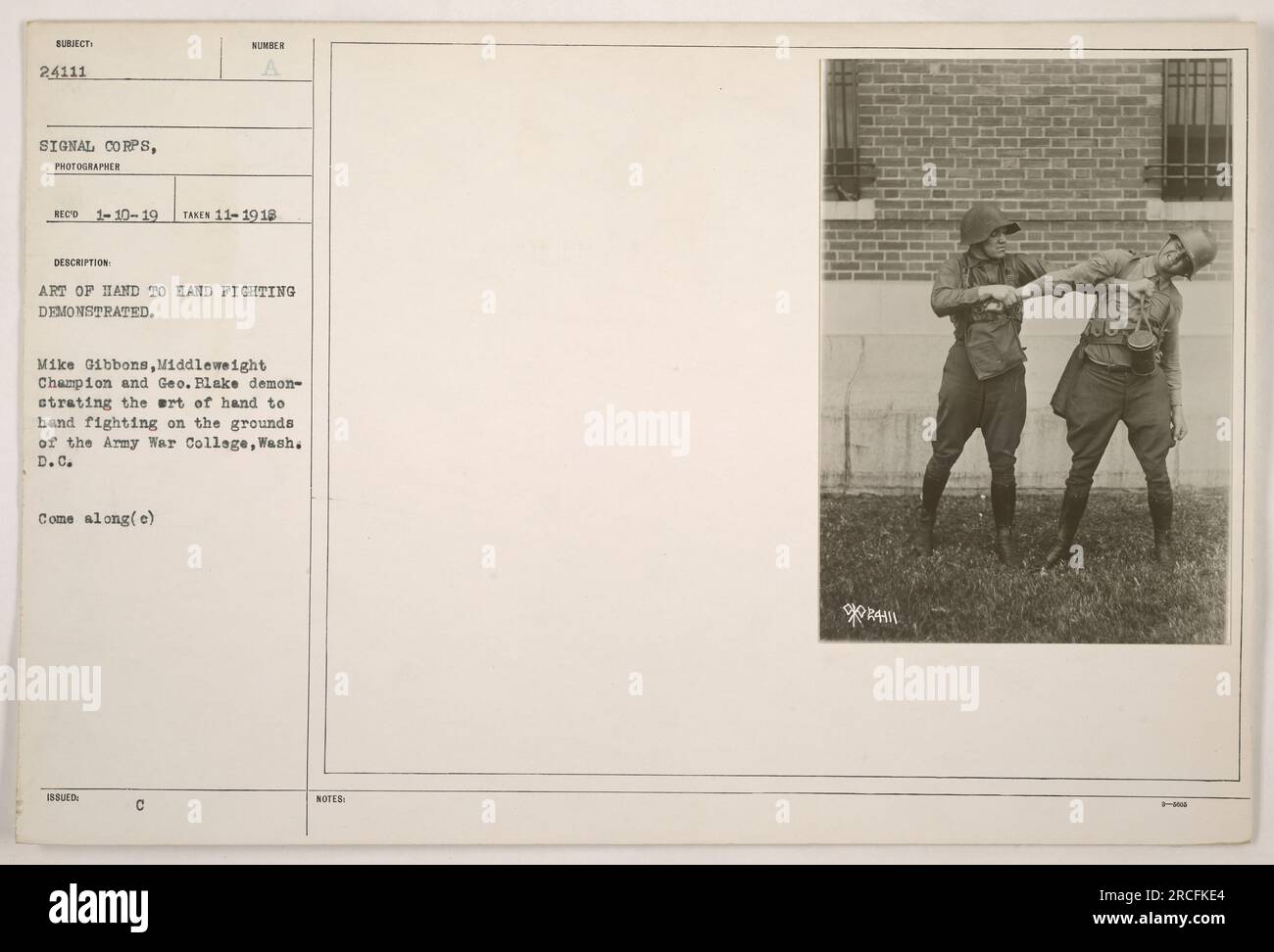 Mike Gibbons, Middleweight Champion, and Geo. Blake demonstrating hand ...