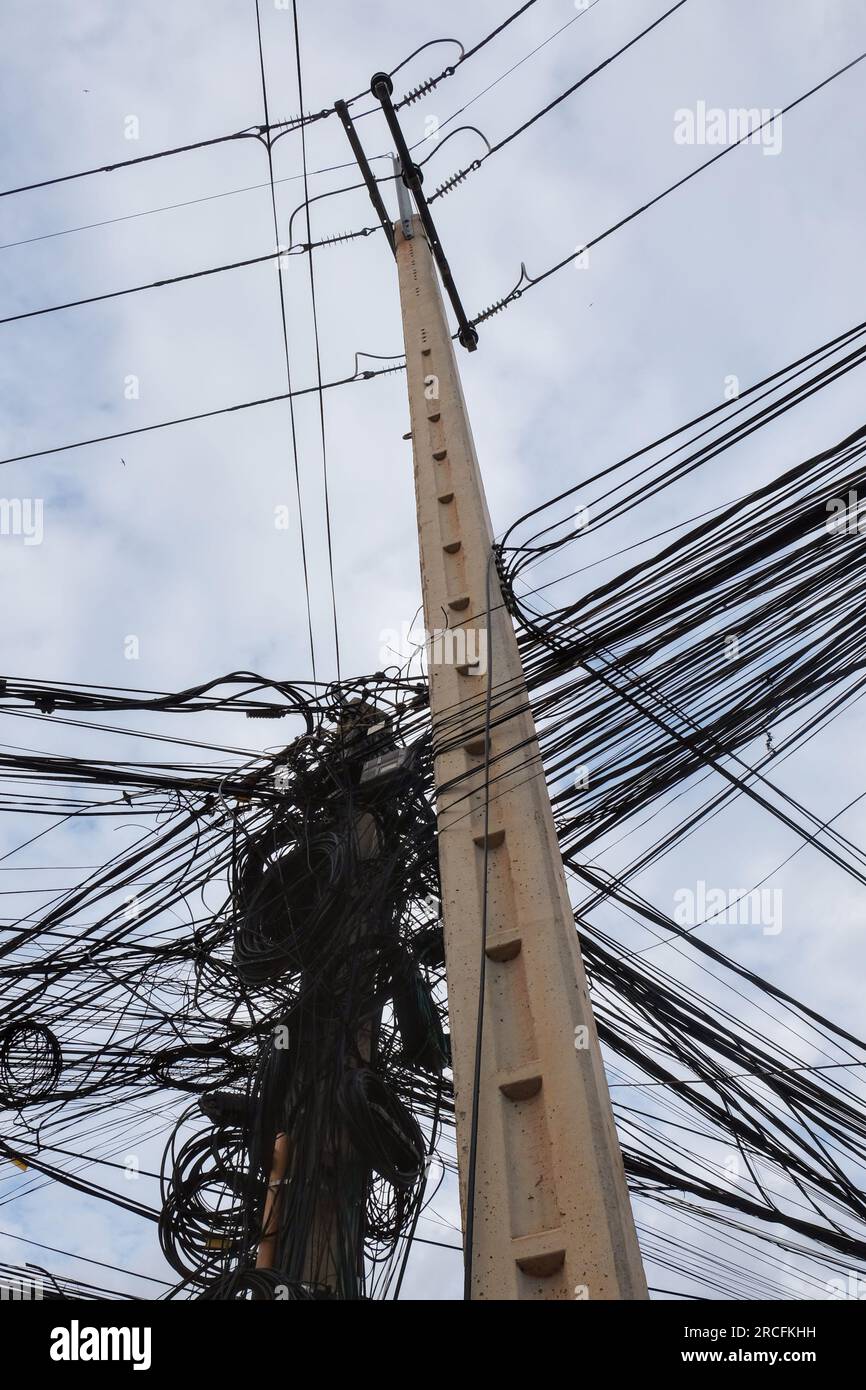 Electric pole many tangled cables hi-res stock photography and images ...