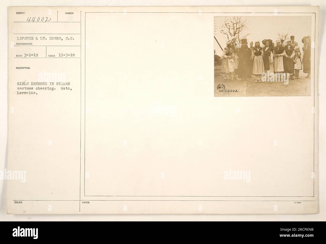 Girls dressed in German costumes cheer during a military event in Mets ...