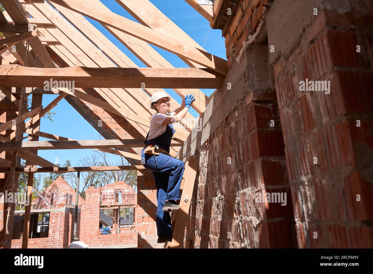 Woman general contractor checking strength of supporting beams Stock ...