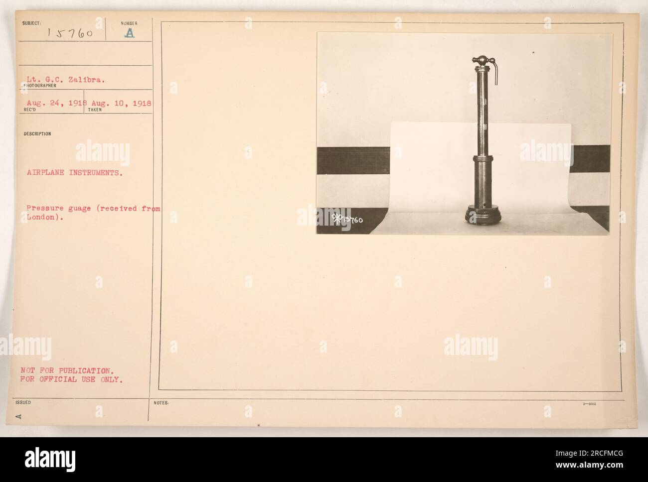 Lt. G.C. Zalibra with an airplane instrument at an unknown location ...