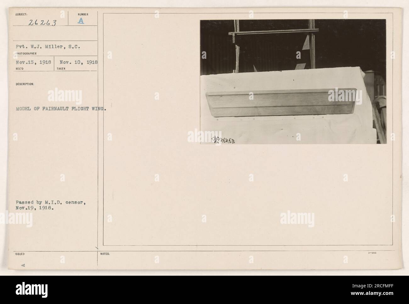 Image shows Pvt. W.J. Miller of the Signal Corps, standing beside a ...