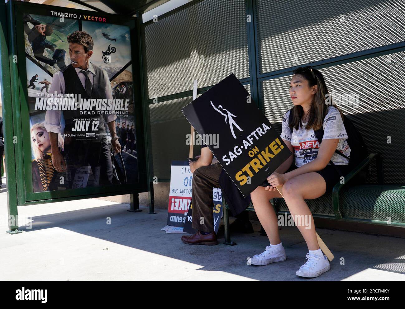 SAG-AFTRA member Amelia Heidy takes part in a rally by striking writers ...