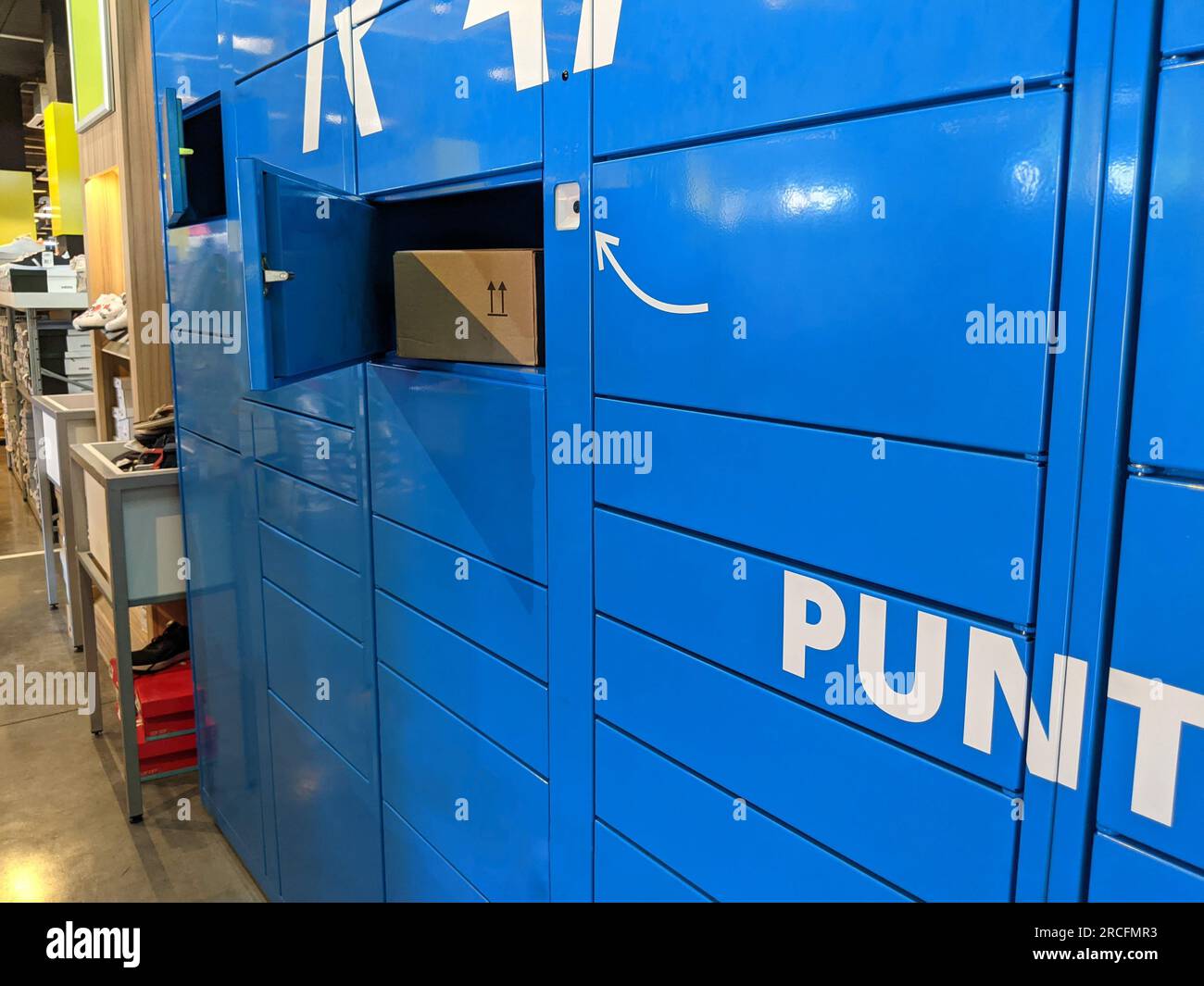 Blue parcel collection lockers in a store Stock Photo - Alamy
