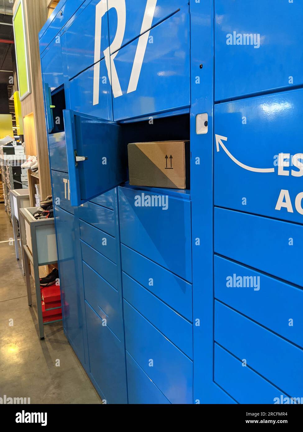 Blue parcel collection lockers in a store Stock Photo - Alamy