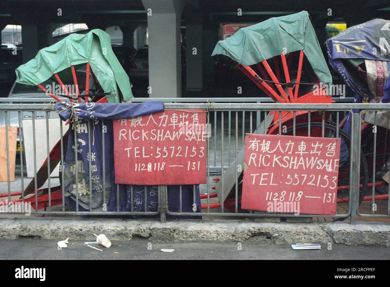 A traditional Hand and walking Rickshaw in Kowloon in the city of ...