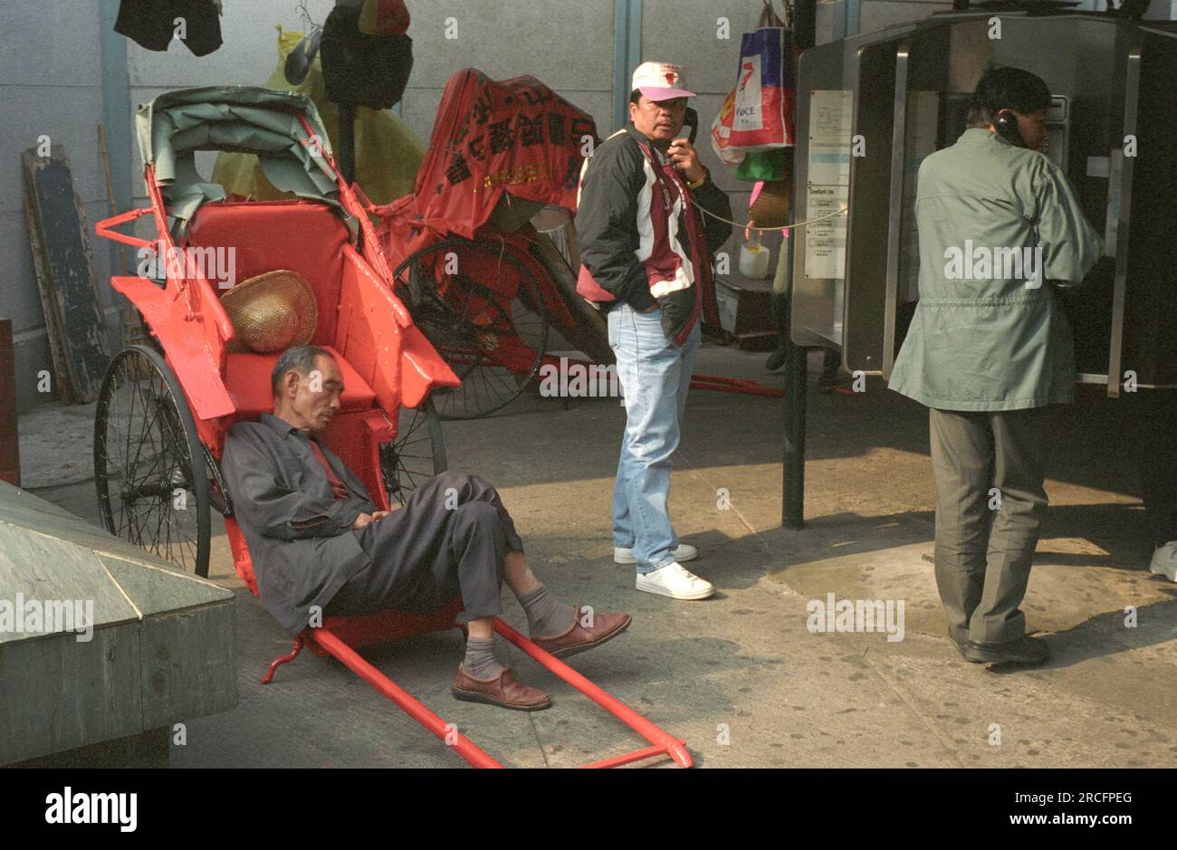 A traditional Hand and walking Rickshaw in Kowloon in the city of ...