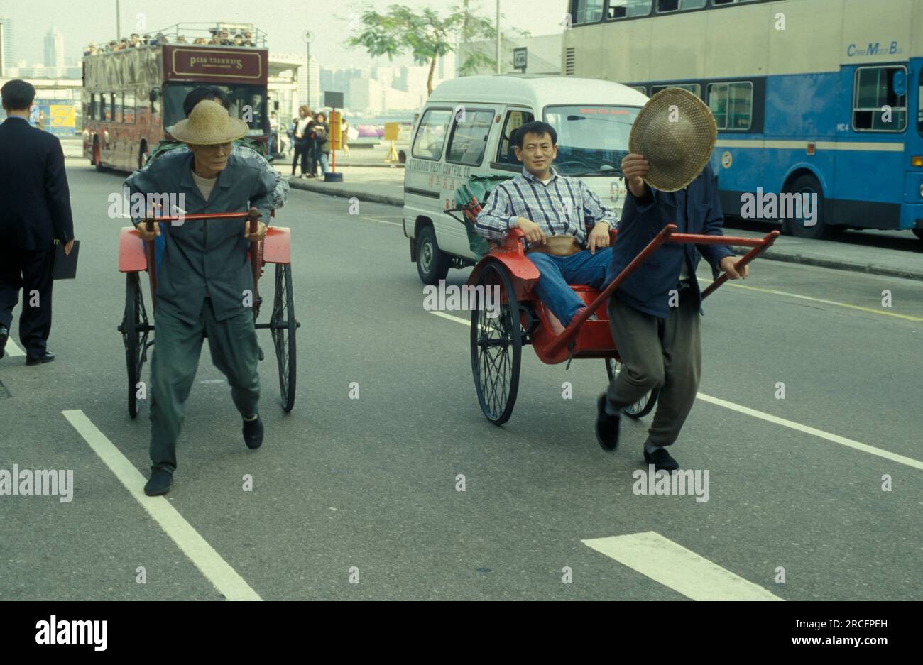 A traditional Hand and walking Rickshaw in Kowloon in the city of ...
