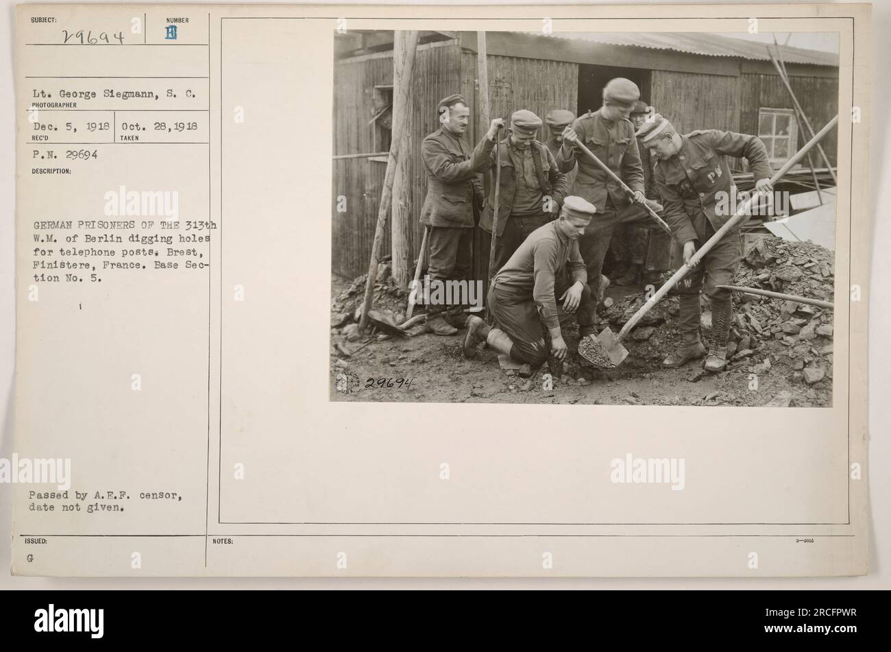 German prisoners of the 313th Waste Management of Berlin digging holes ...