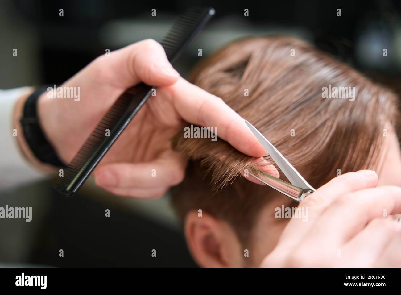 Photo of barber using scissors and comb indoors Stock Photo - Alamy