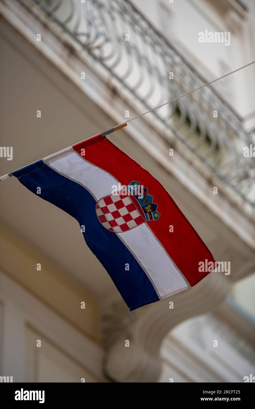 national flag of croatia flying beneath an historic balcony in grad ...