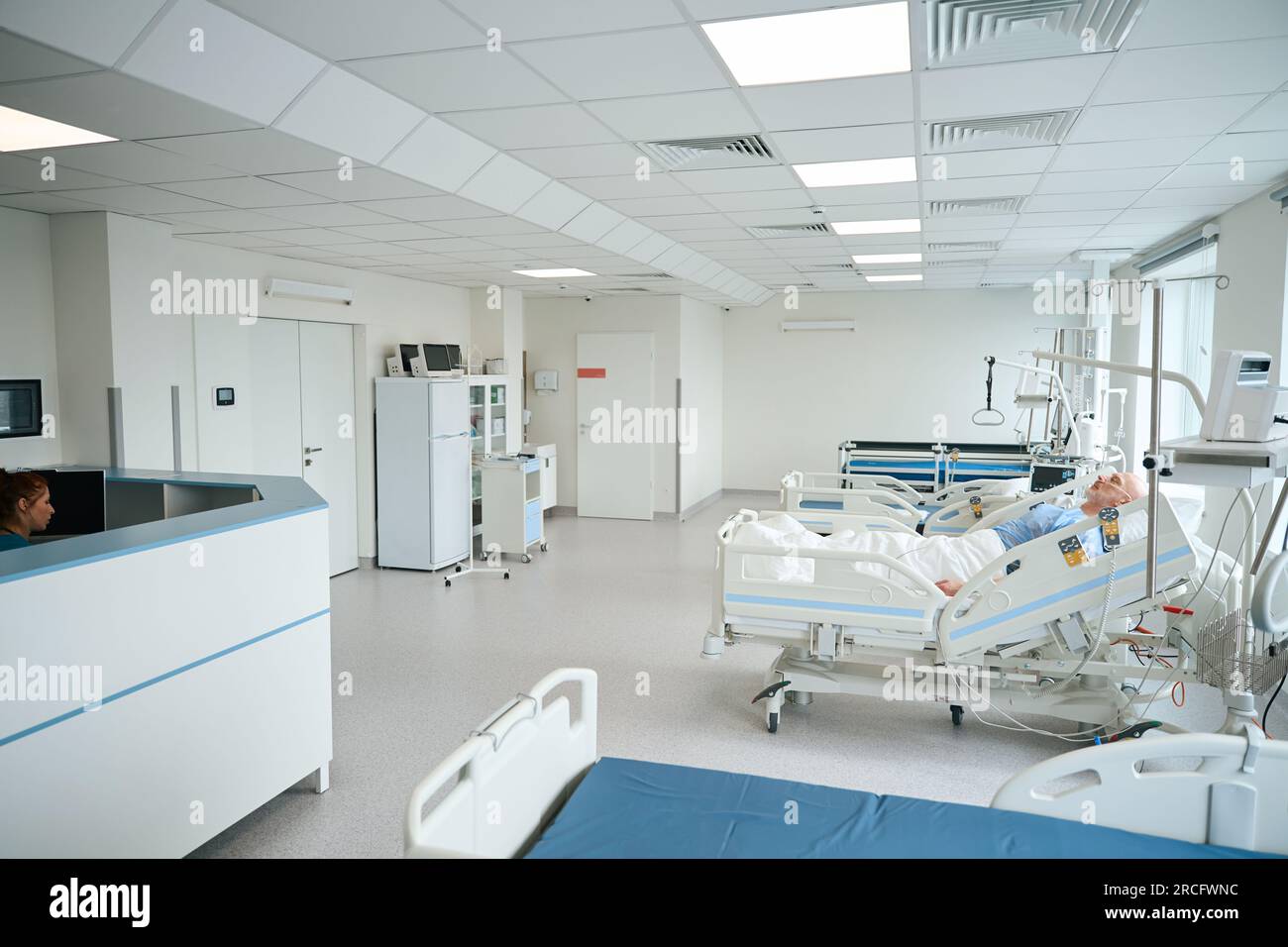 Intensive care ward with medical equipment and patient Stock Photo - Alamy